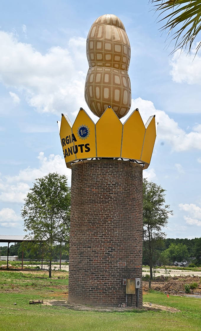 The brick tower provides a sturdy foundation for peanut greatness. Those shrubs aren't just for show&mdash;they're the monument's entourage, keeping things classy.