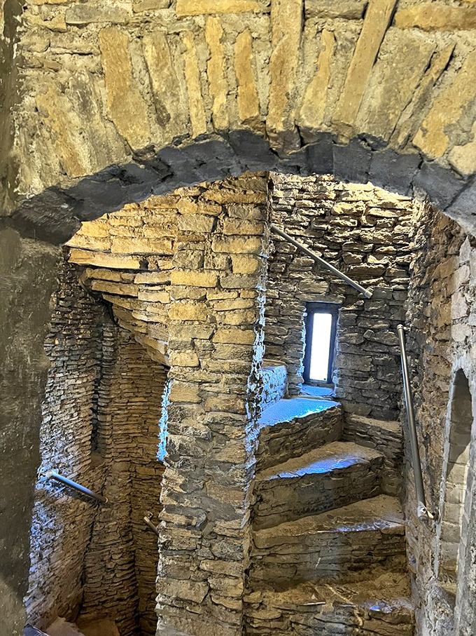 These stone spiral stairs weren't designed for modern building codes. The clockwise twist gave defenders the upper hand against right-handed attackers&mdash;medieval engineering at its finest.