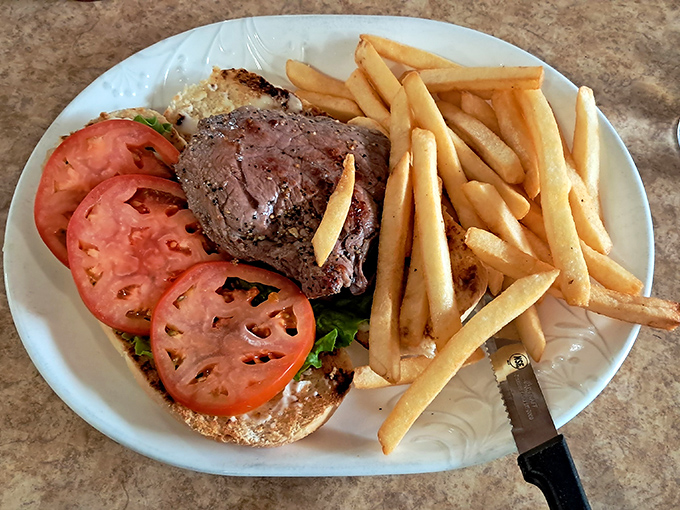 This isn't just a steak sandwich&mdash;it's architecture with flavor, where juicy beef and garden-fresh tomatoes create the skyline of satisfaction.