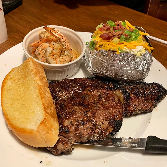 Surf meets turf in perfect harmony. That steak's bark is as impressive as its bite, while the shrimp stand ready for their supporting role.