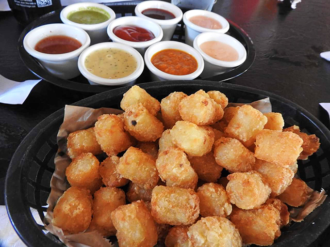 Tater tots: the food that proves adulthood doesn't mean abandoning childhood pleasures. These golden nuggets with dipping sauces are worth every calorie.