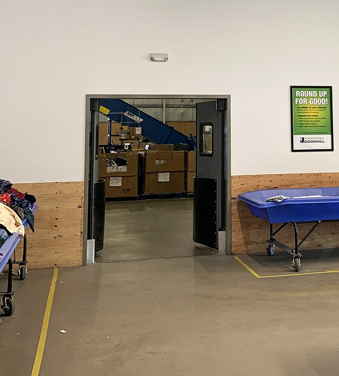 The gateway to behind-the-scenes operations. Like Willy Wonka's factory, what happens beyond these doors turns retail castoffs into recycling magic.