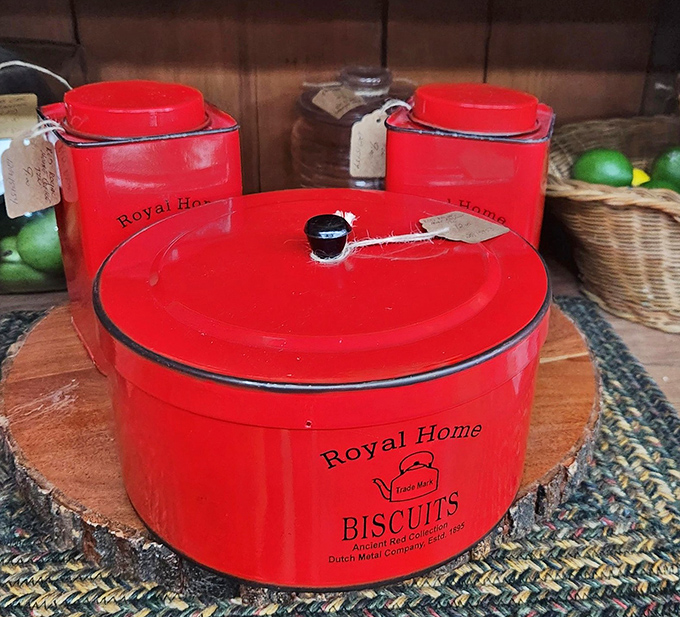 These cherry-red Royal Home canisters aren't just kitchen storage; they're time capsules from when "biscuits" were a daily necessity.