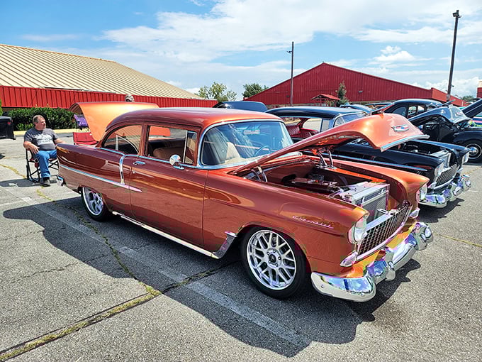 Classic car enthusiasts find their happy place in the parking lot, where vintage Chevys gleam under the Tennessee sun like automotive time capsules.