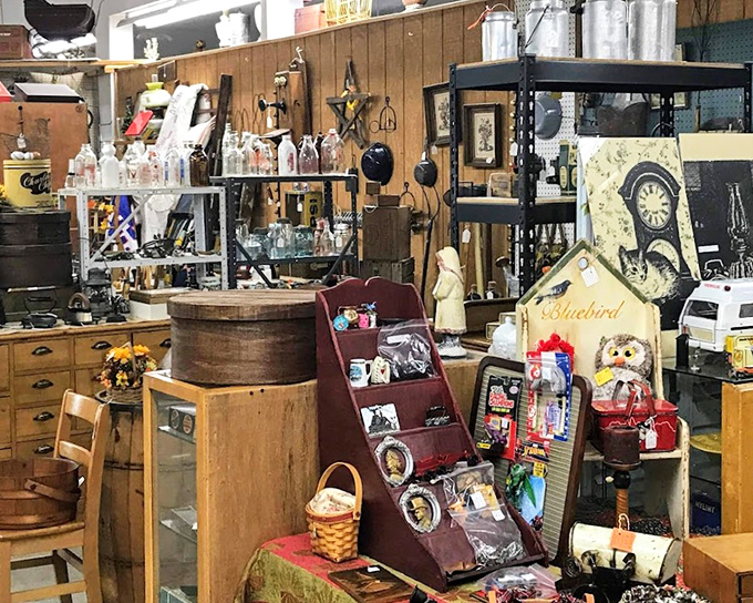 Organized chaos at its finest! From wooden barrels to vintage signs, this booth is where rustic farmhouse dreams and collector obsessions collide.