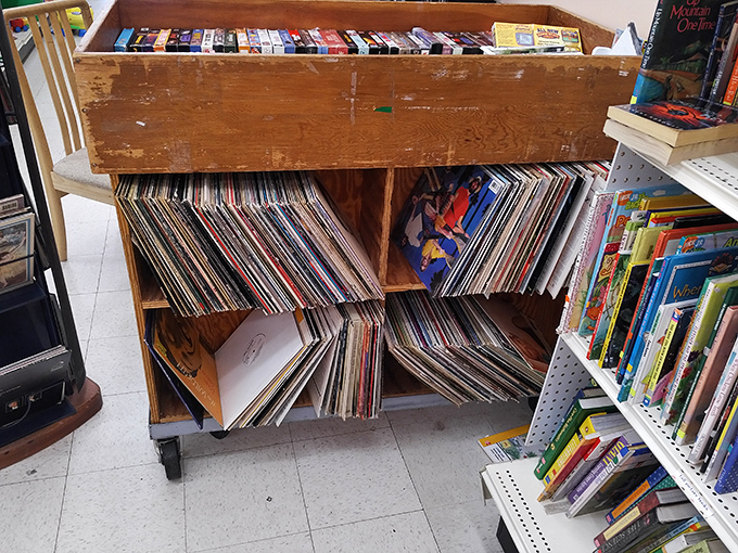 Vinyl enthusiasts can dig through these wooden crates like archaeologists uncovering the soundtrack of decades past. Your next musical obsession awaits.
