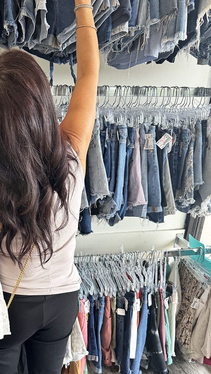 The thrill of the hunt captured in action &ndash; reaching for that perfect pair of jeans feels like striking fashion gold.