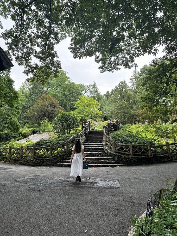 The approach to wonder. Rustic stairs bordered by Central Park's thoughtfully designed landscaping invite exploration of this architectural treasure.