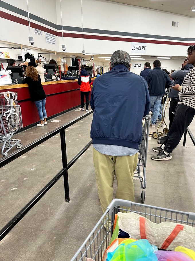 The checkout line: where strangers become temporary comrades in the shared victory of thrift store triumph.