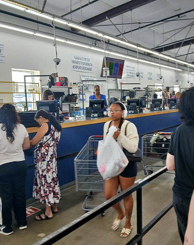 The checkout line: where strangers become temporary friends united by the universal language of "You won't believe what I found for only..."