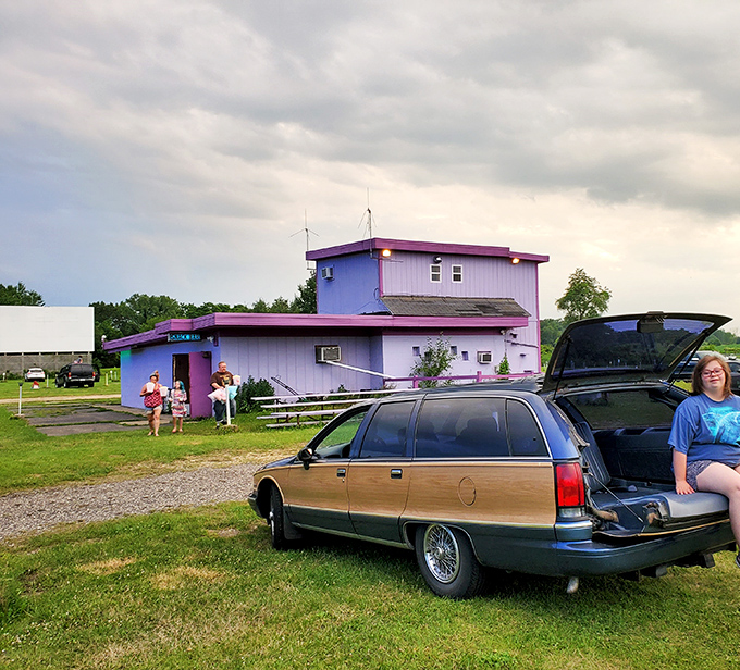 Classic American scene: station wagon tailgate down, lawn chairs ready, and that pre-movie excitement hanging in the Wisconsin air.