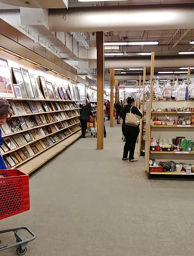 Treasure hunters navigate the aisles with the focus of archaeologists, each shopper hoping to unearth that perfect vintage find among the everyday offerings.