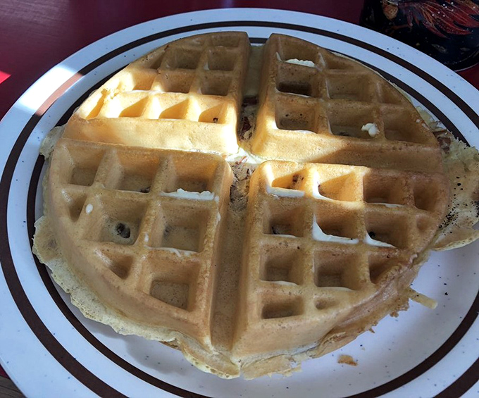 A waffle that's achieving that rare balance: crispy exterior, fluffy interior. The breakfast equivalent of finding beachfront property at a bargain price.