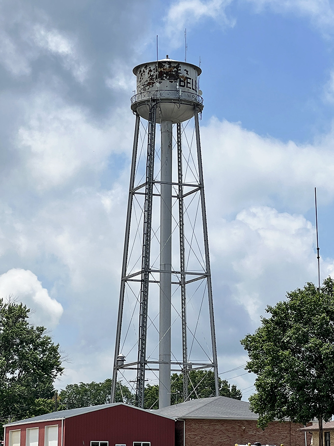 Belle's water tower watches over the town alongside its newer, more eccentric neighbor down below.