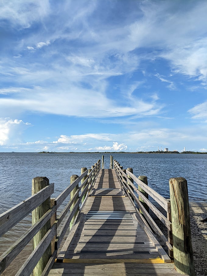 The fishing pier stretches toward the horizon like a wooden runway, where the daily fashion show features pelicans and spectacular sunsets.