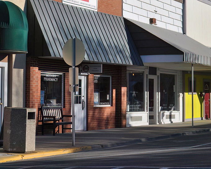 The simple and colorful storefronts of Arthur serve both "English" and Amish customers, with hitching posts still in regular use.