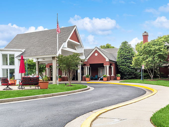 The American flag waves proudly at Aspenwood, where patriotic spirit meets comfortable living in the heart of Silver Spring.