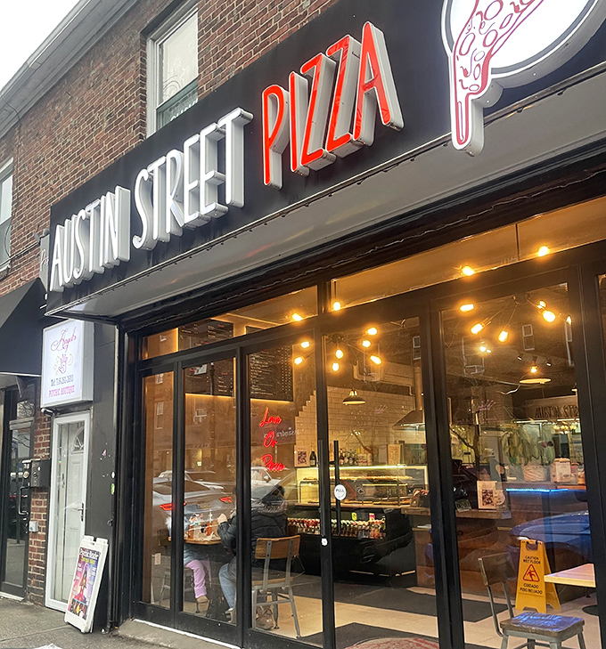 Austin Street Pizza's sleek black storefront brings modern style to Forest Hills. Those big windows let you watch the pizza magic happen before stepping inside.
