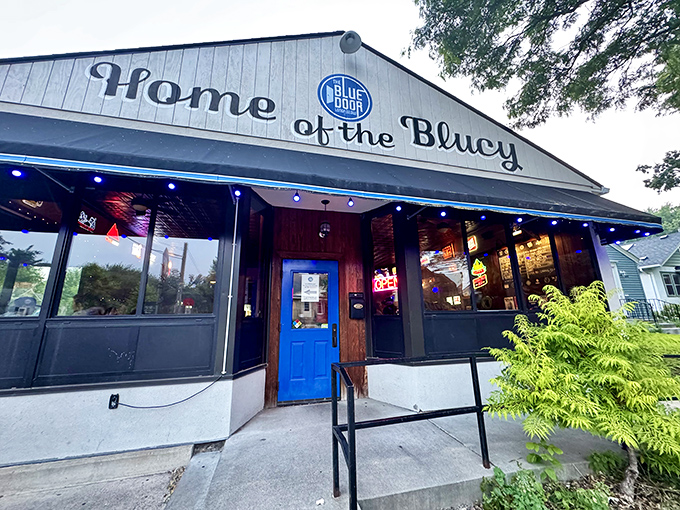 "Home of the Blucy" proclaims the Blue Door Pub, where cheese-stuffed innovation meets neighborhood charm.