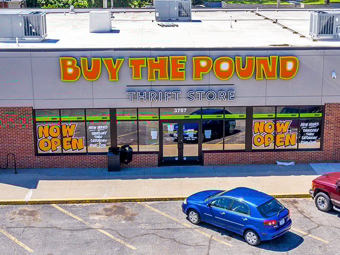 "Buy The Pound" announces itself with carnival-bright lettering. This is where thrifting becomes a thrilling weight-based treasure hunt!