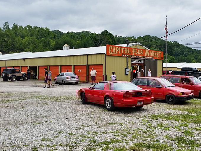 Capitol Flea Market's bold orange sign promises no-frills bargain hunting against a backdrop of West Virginia hills.