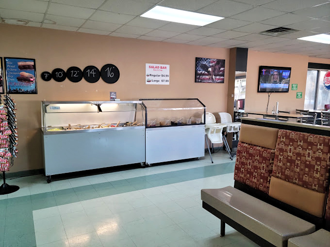 A laid-back spot where the salad bar is fresh, the booths are comfortable, and the pizza feels right at home.