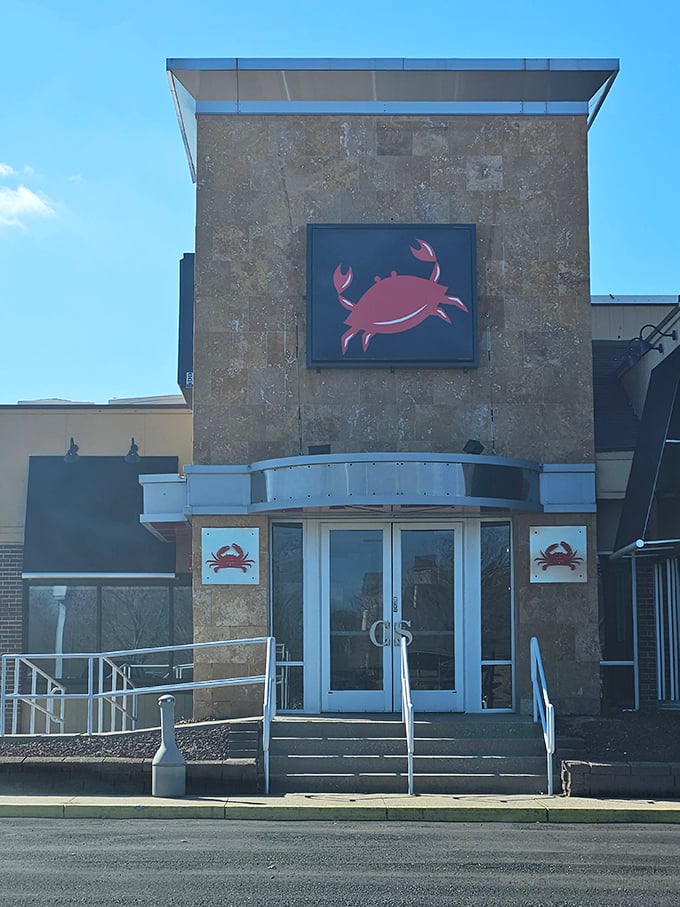 The crab logo says it all - prepare for a hands-on seafood adventure that's messy fun.