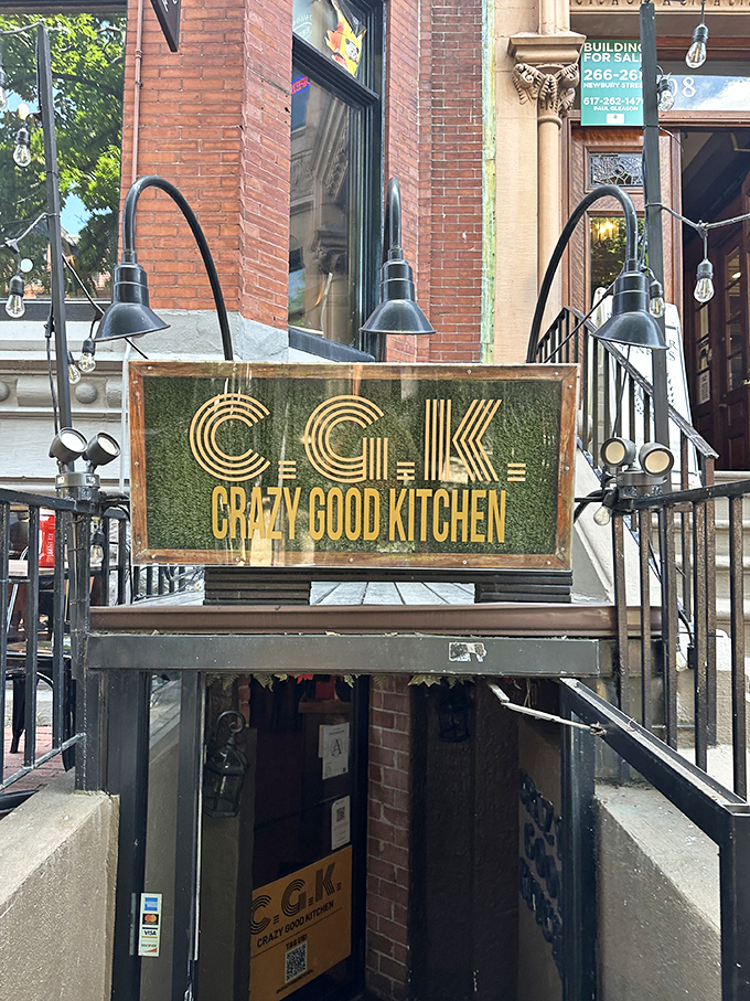 Crazy Good Kitchen's moss-covered sign hints at the wild flavors waiting inside this culinary adventure. 