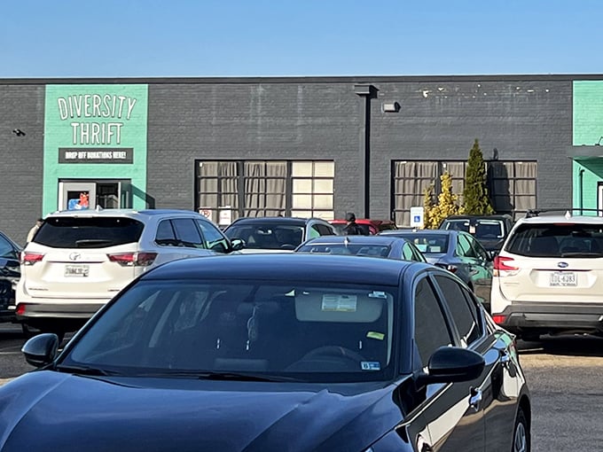 Diversity Thrift's mint green entrance pops against the dark building, inviting curious shoppers inside.