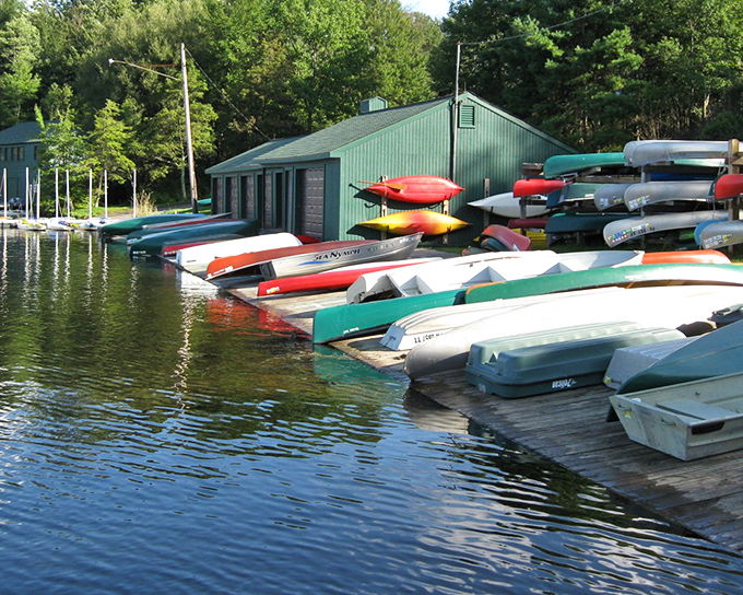 Rainbow kayaks lined up like colorful soldiers ready to conquer the most peaceful lake in Pennsylvania.