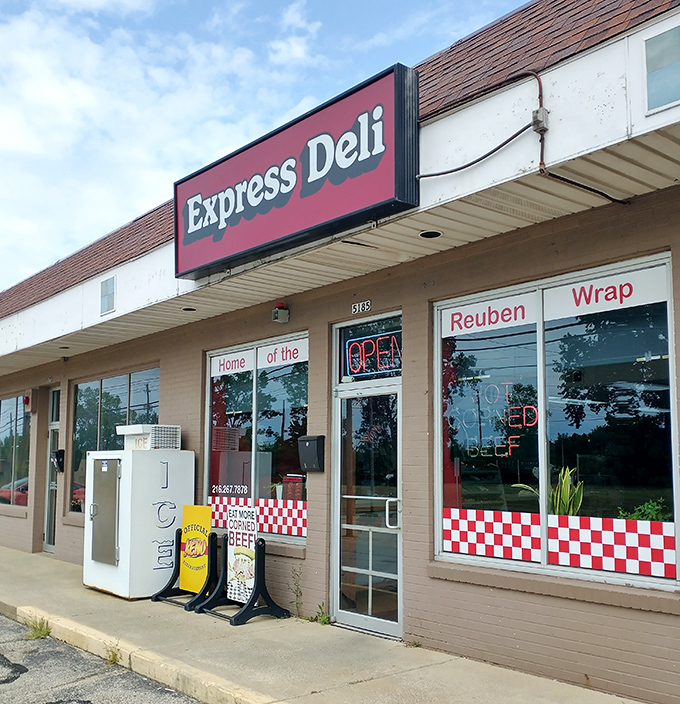 Express Deli's window proudly announces its specialty—hot corned beef that makes fast food seem like a distant memory.