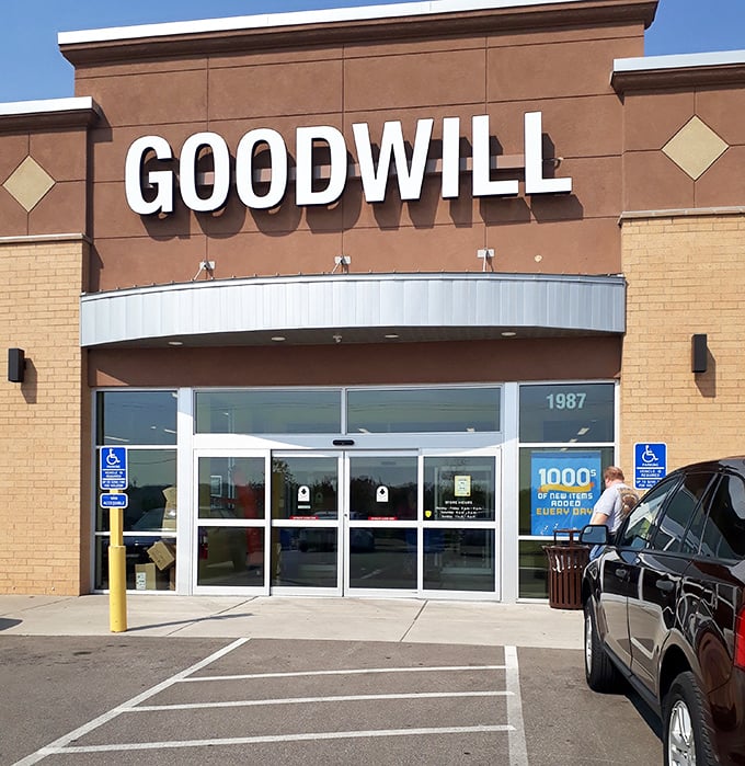 Goodwill's familiar signage stands proud against a clear blue sky &ndash; democracy in shopping form.