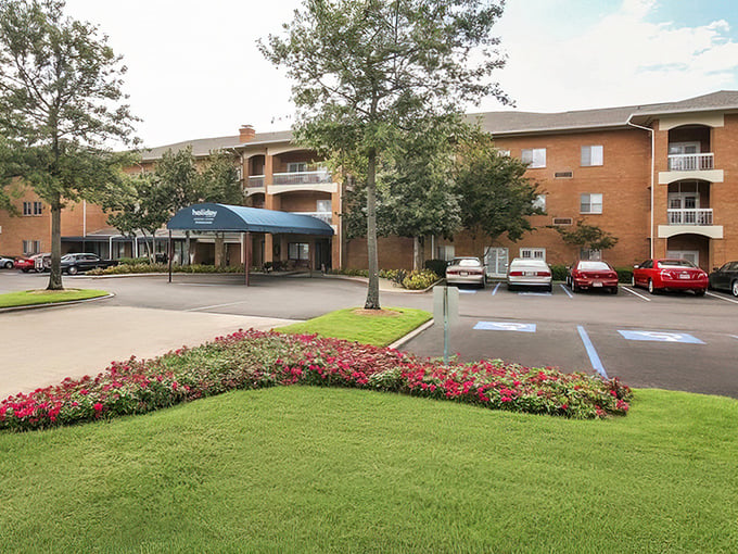 Holiday Chateau's entrance guards a hidden community where those majestic oaks have been witnessing happy retirements for decades.