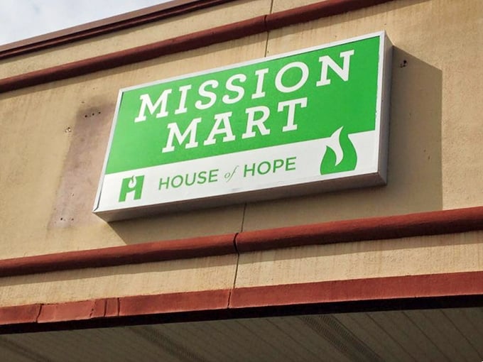 House of Hope's green sign offers a promise: shop here and spread hope. A mission with merchandise.