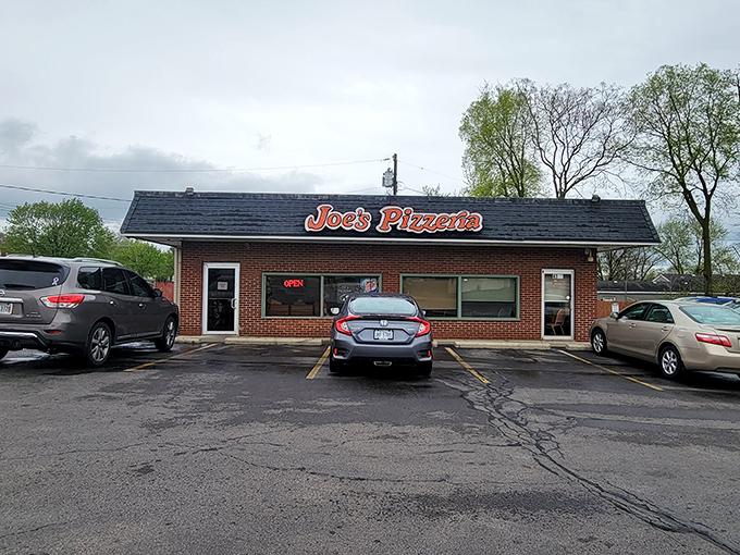 Joe's simple storefront proves that great pizza doesn't need flashy marketing, just loyal customers.