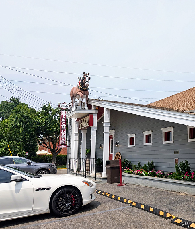 Kinchley's iconic horse statue stands guard over pizza paradise. This roadside landmark has welcomed hungry travelers for decades.
