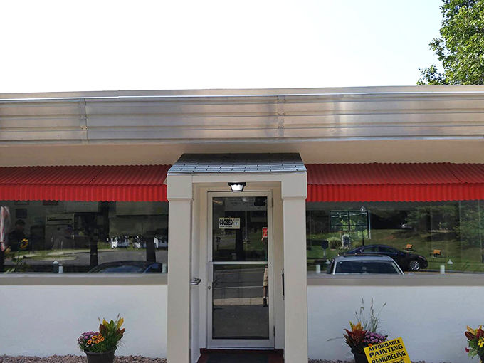 The weathered sign and motor shop next door create an authentic slice of Americana.