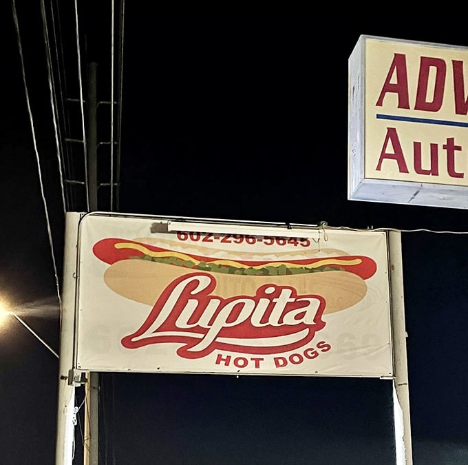 Lupita's sign glows with hot dog promise in the night. Those bacon-wrapped Sonoran dogs inside are the stuff of late-night food dreams.