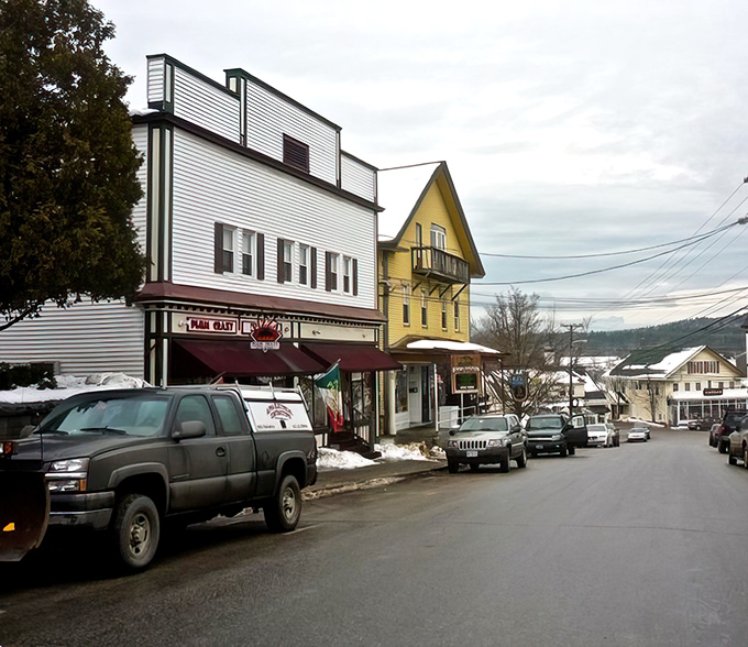 Winter transforms main streets into scenes from "It's a Wonderful Life," complete with snow-dusted storefronts and hometown warmth.