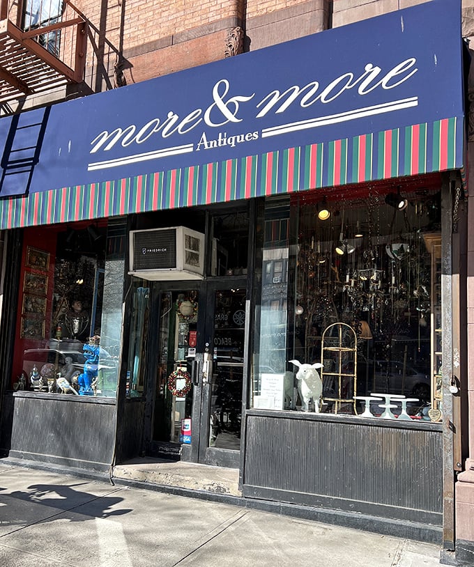 That striped awning is like a beacon for Manhattan's treasure hunters. Even the window displays are curated with surgical precision!