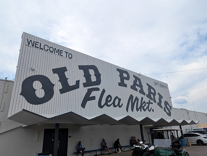 Old Paris Flea Market's massive sign announces a shopping experience as grand as its name.