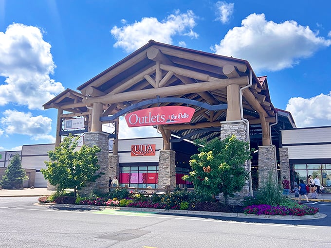 The Outlets at the Dells' magnificent log cabin entrance transforms shopping into a rustic adventure worthy of Paul Bunyan.