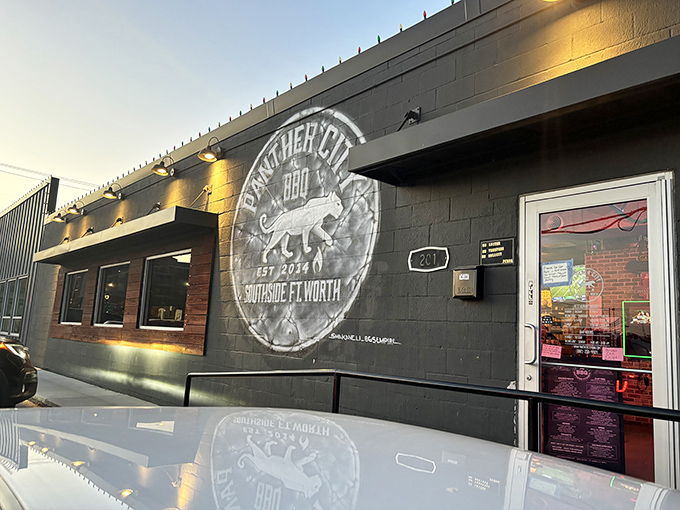 Panther City BBQ's cool logo glows against the night sky. From food truck to Fort Worth favorite&mdash;a true Texas success story.