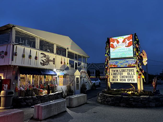 Petey's Summertime Seafood's sign glows like a lighthouse for hungry travelers. Those colorful buoys aren't just decoration&mdash;they're a promise of ocean-fresh delights.