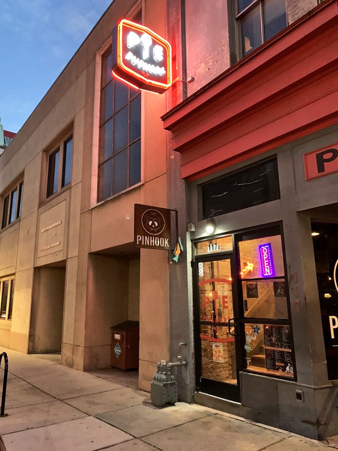 Downtown Durham's pizza rebel! Pie Pushers' unassuming glass door entrance is like finding the secret password to flavor town.