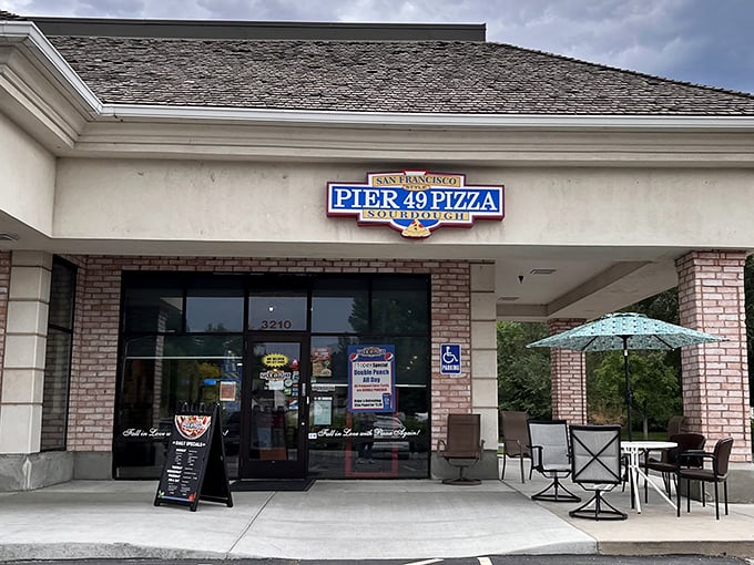 Strip mall exterior, gourmet interior dreams - sometimes the best pizza hides in plain sight completely.