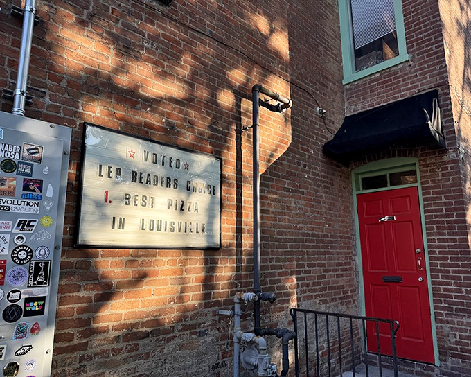 That red door beckons like a pizza lighthouse guiding hungry ships to cheesy shores.