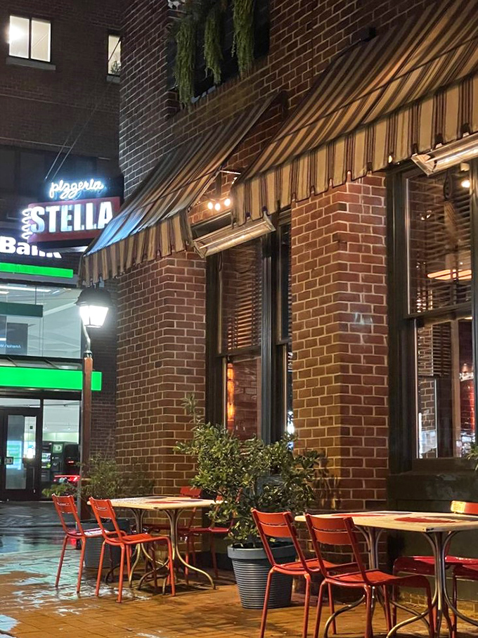 Sidewalk dining under striped awnings transforms ordinary evenings into memorable Philadelphia food adventures completely.