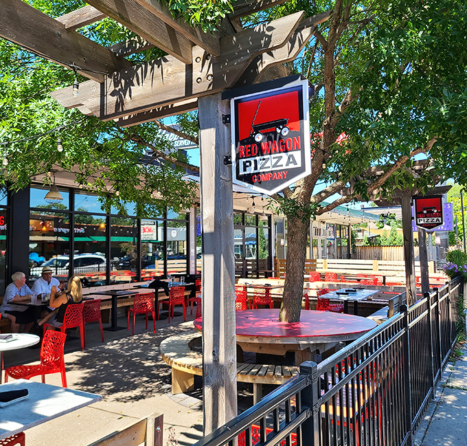 Red Wagon's outdoor patio &ndash; where pizza meets paradise under string lights and Minnesota's summer sky.
