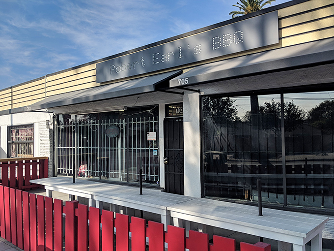 Robert Earl's sleek storefront with its bright red patio fence says, "We're serious about BBQ, not decoration."